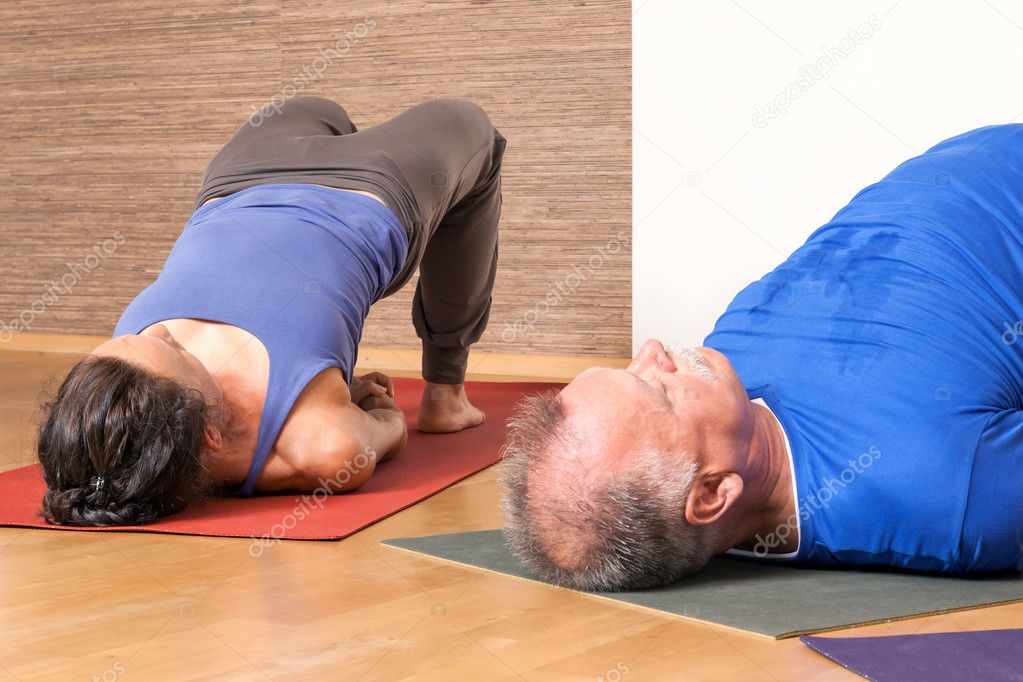 Yoga Exercise - Setu Bandha Sarvangasana — Stock Photo © magann #37932429