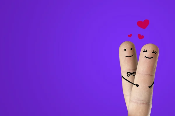 The happy finger couple in love with painted smiley and hold dia Stock ...
