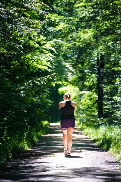 Woman Runner In The Woods — Stock Photo © cardmaverick #2625539
