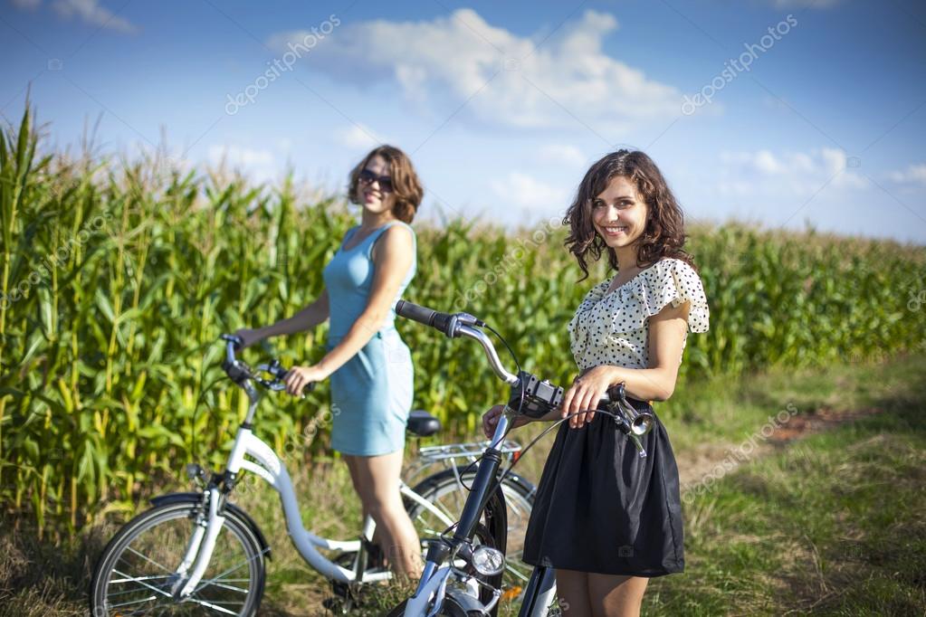 Two pretty girls on bike tour — Stock Photo © BrunoWeltmann #31404083