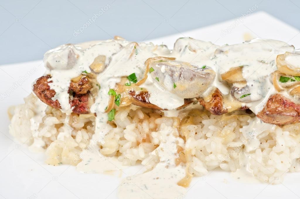 Risotto with chicken liver — Stock Photo © olinchuk #13129420