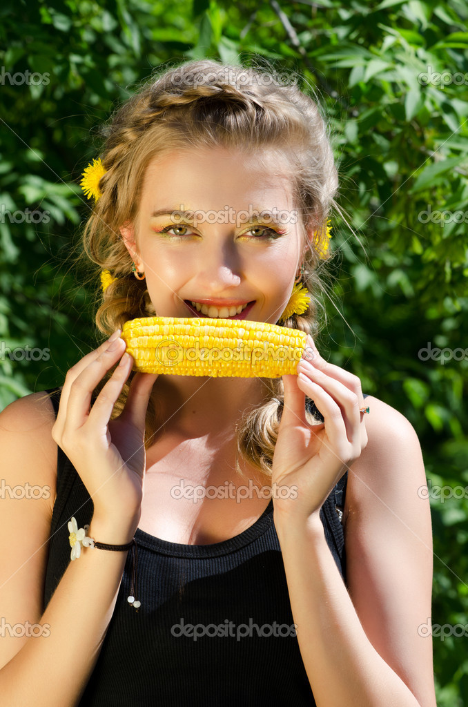Woman eating corn-cob — Stock Photo © olinchuk #14172859