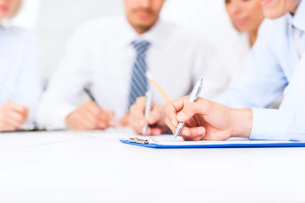 Business people writing Stock Photo by ©mast3r 43565791