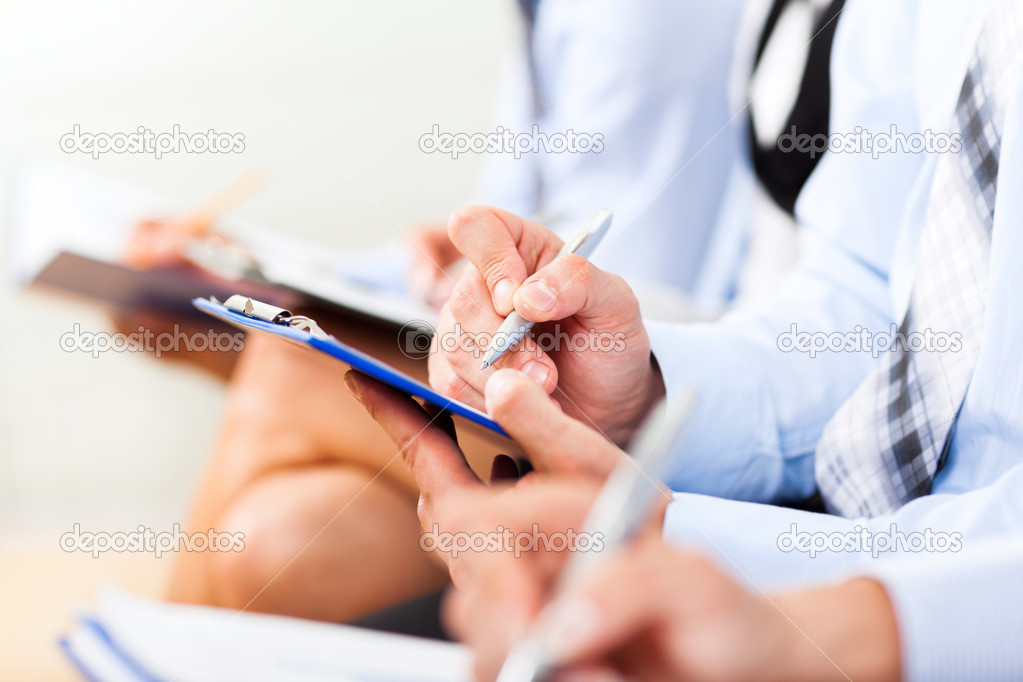Business people writing Stock Photo by ©mast3r 43565791