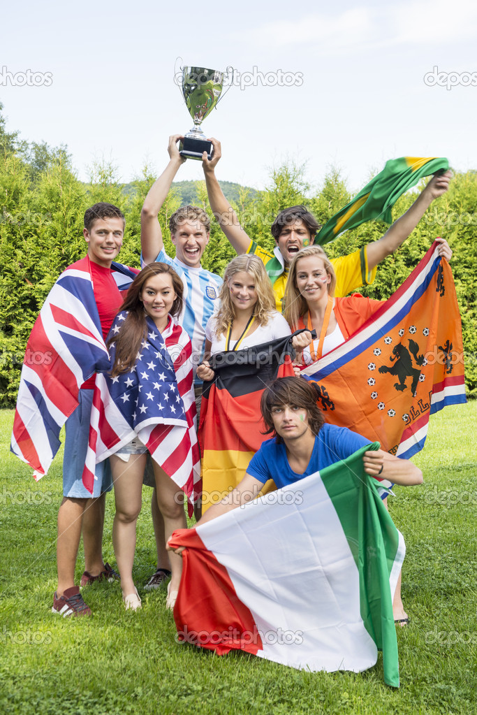 Athletes With Various National Flags Celebrating In Park Stock Photo by ...