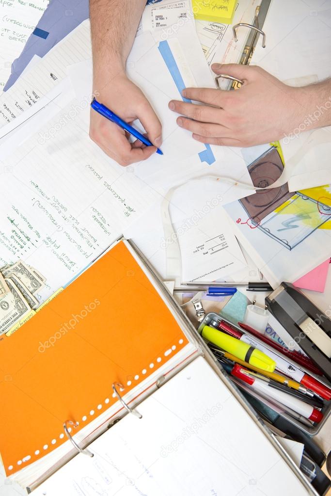 Messy desk with hand notes — Stock Photo © Corepics #46796545