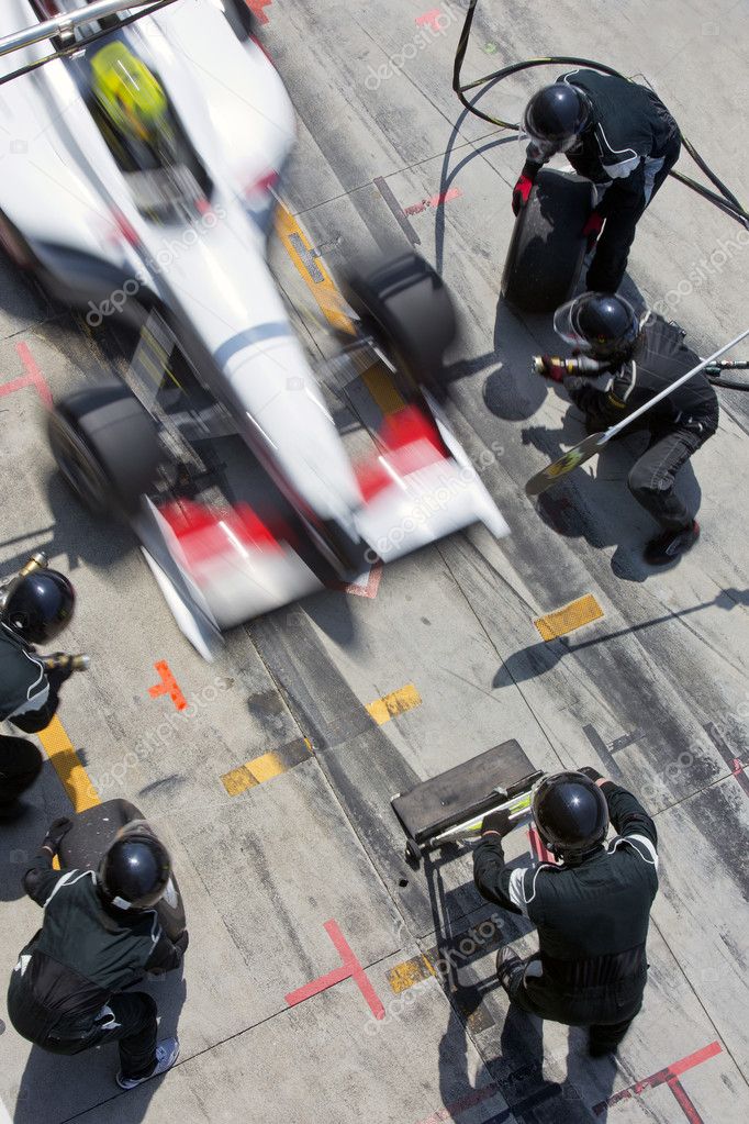Pit crew in action — Stock Photo © Corepics #49786067