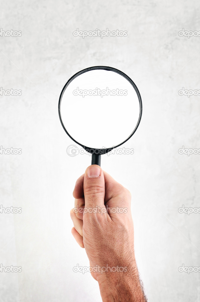 Hand holding magnifying glass Stock Photo by ©stevanovicigor 38079471
