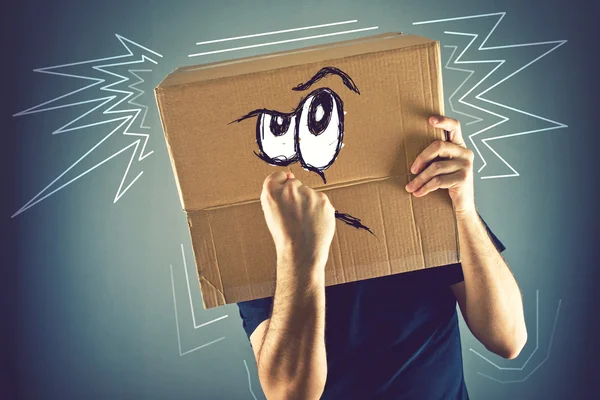 Man with cardboard box on his head and sad face expression Stock Photo ...