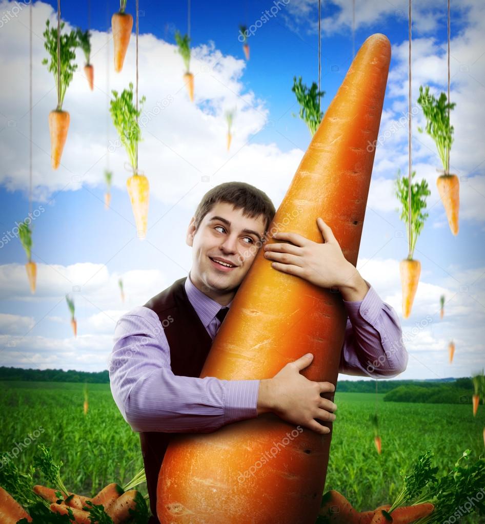 Huge carrot and man Stock Photo by ©Nomadsoul1 41012757