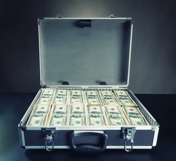 Case full of dollars Stock Photo by ©koya979 73219785