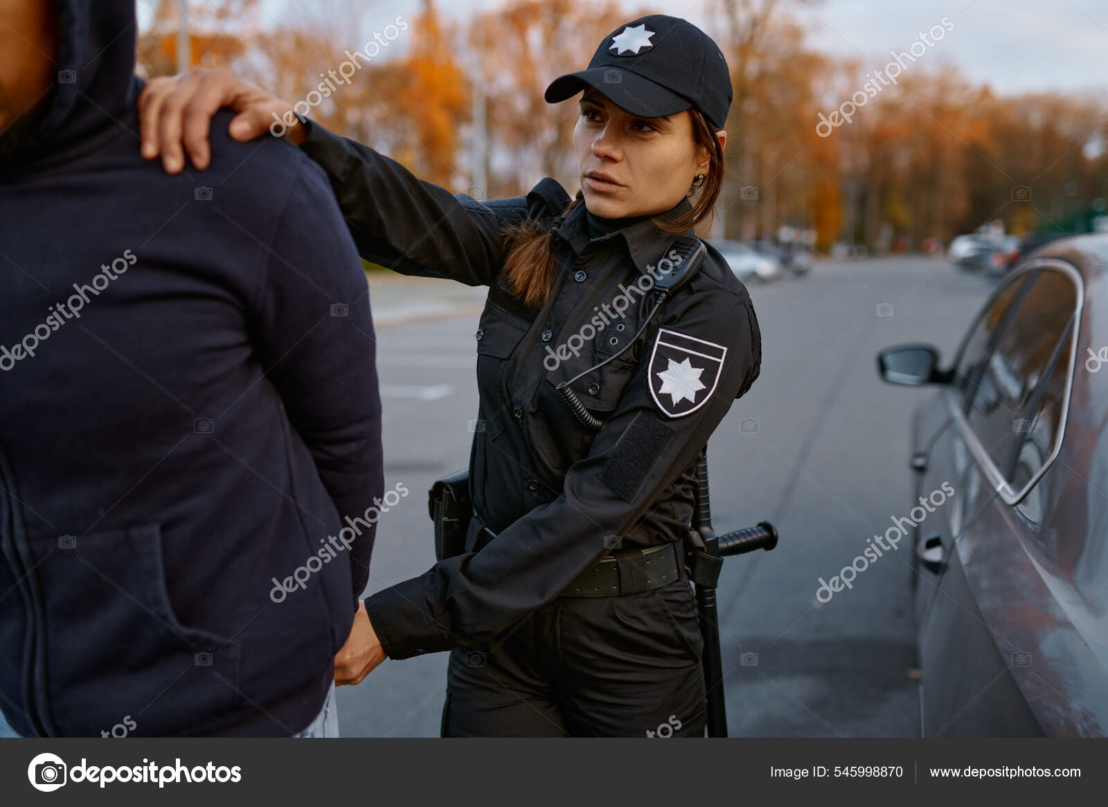 Policewoman arresting man car thief on road — Stock Photo © Nomadsoul1 ...
