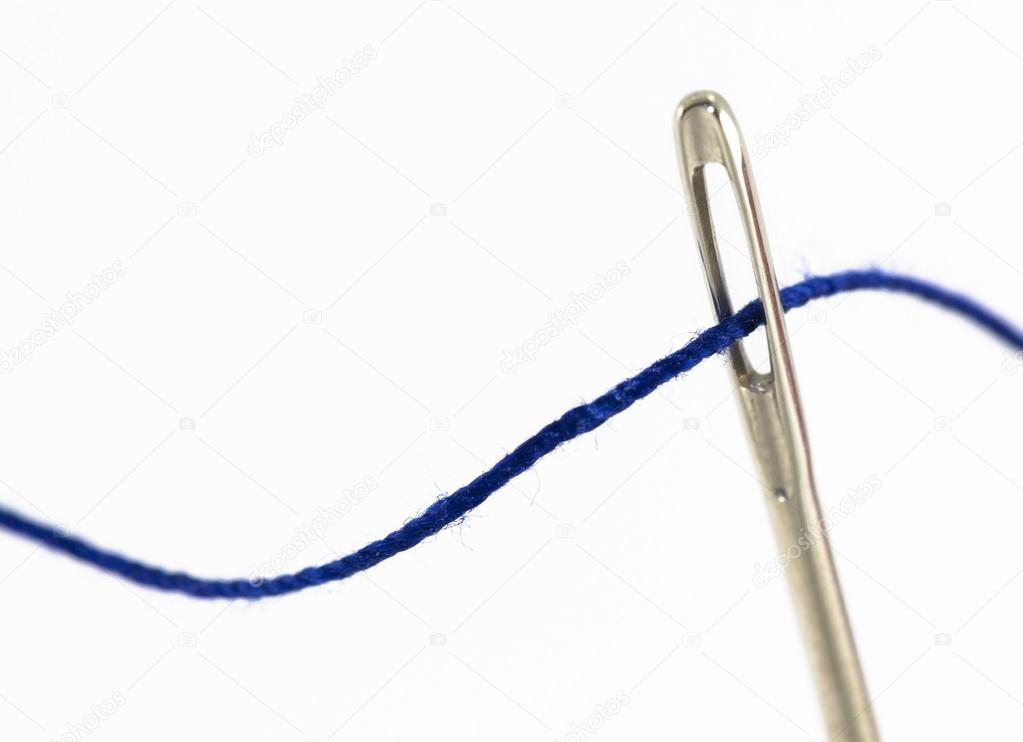 Needle and thread on white background Stock Photo by ©sqback 26744301