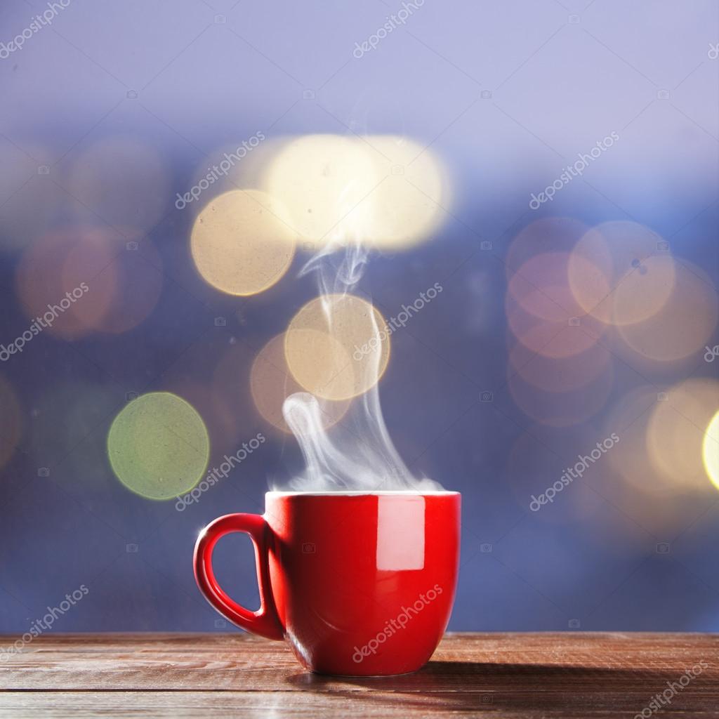 Steaming cup of coffee Stock Photo by ©gdolgikh 39267867