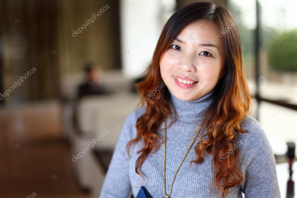 Smiling asian business woman — Stock Photo © zhudifeng #16175713 Smiling asian business woman — Stock Photo © zhudifeng #16175713
