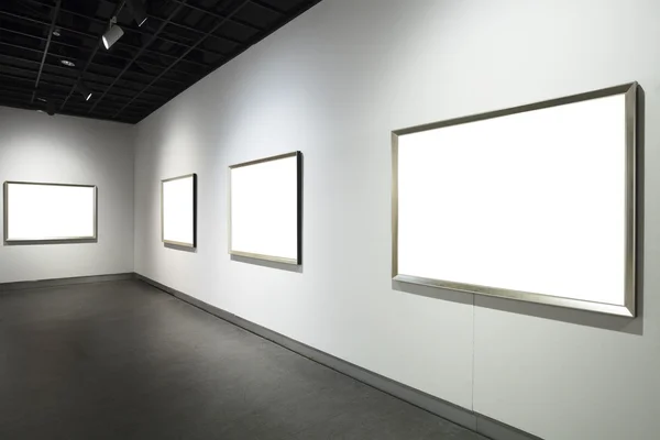 Empty frames in a gallery room against a white wall Stock Photo by ©el ...