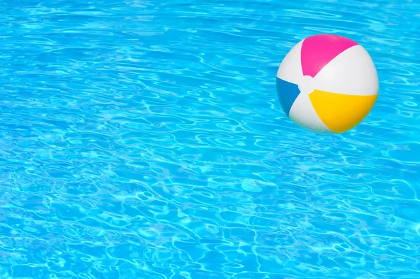 Inflatable ball floating in swimming pool — Stock Photo © pajche #19464461
