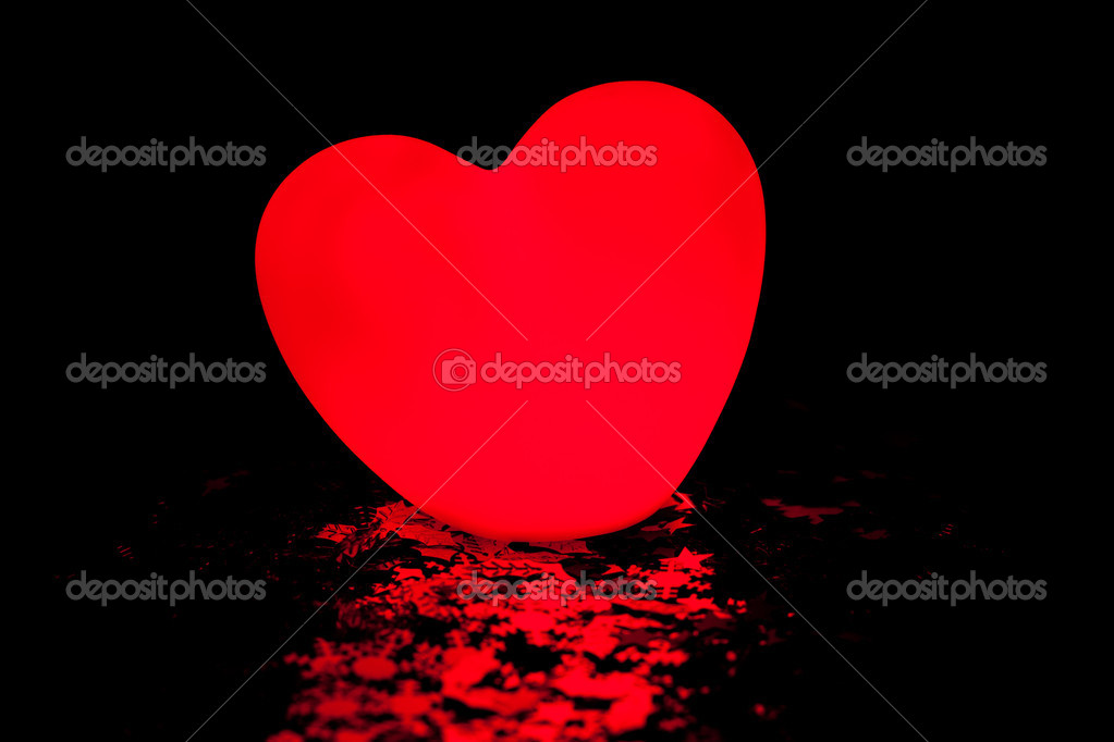 Glowing love heart on black background Stock Photo by ©mreco99 13147719