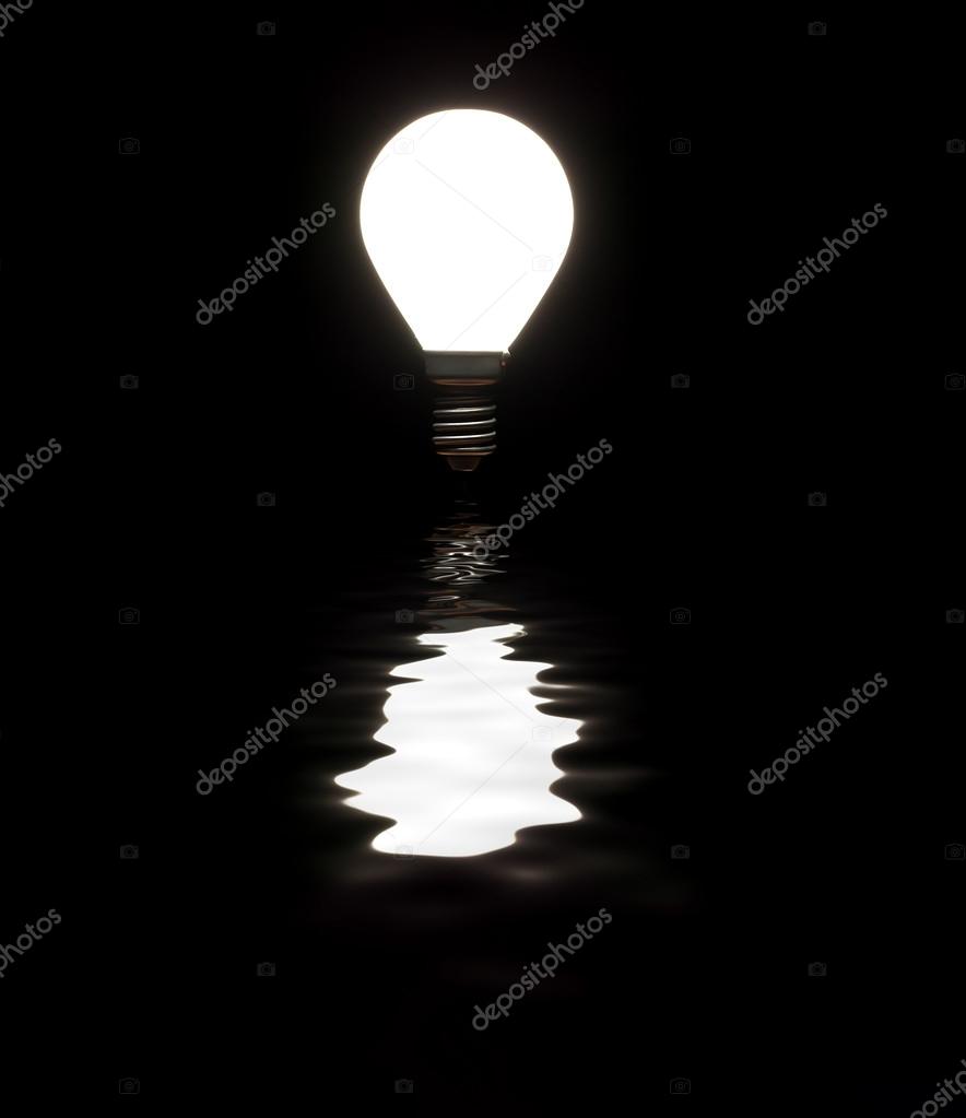 Light bulb shining with reflection in water on black Stock Photo by ...