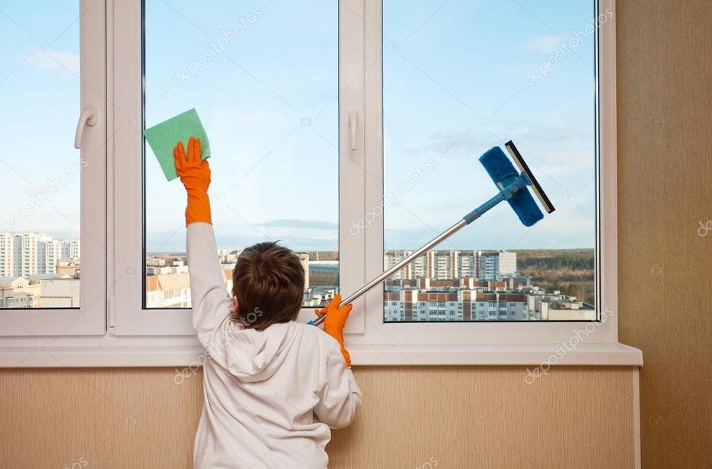 A boy washes a window Stock Photo by ©olenka-2008 24471613