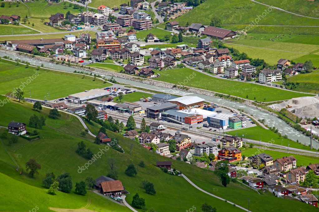 Beautiful town in a valley of the Alps in Switzerland — Stock Photo ...