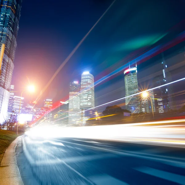 Traffic light trails in modern business city — Stock Photo © zhudifeng ...