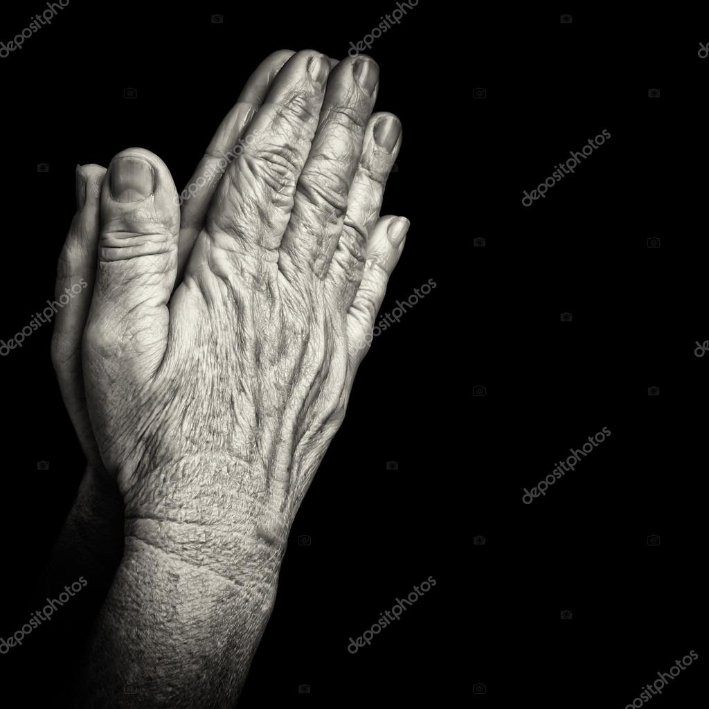 Old wrinkled hands praying Stock Photo by ©kmiragaya 18568835