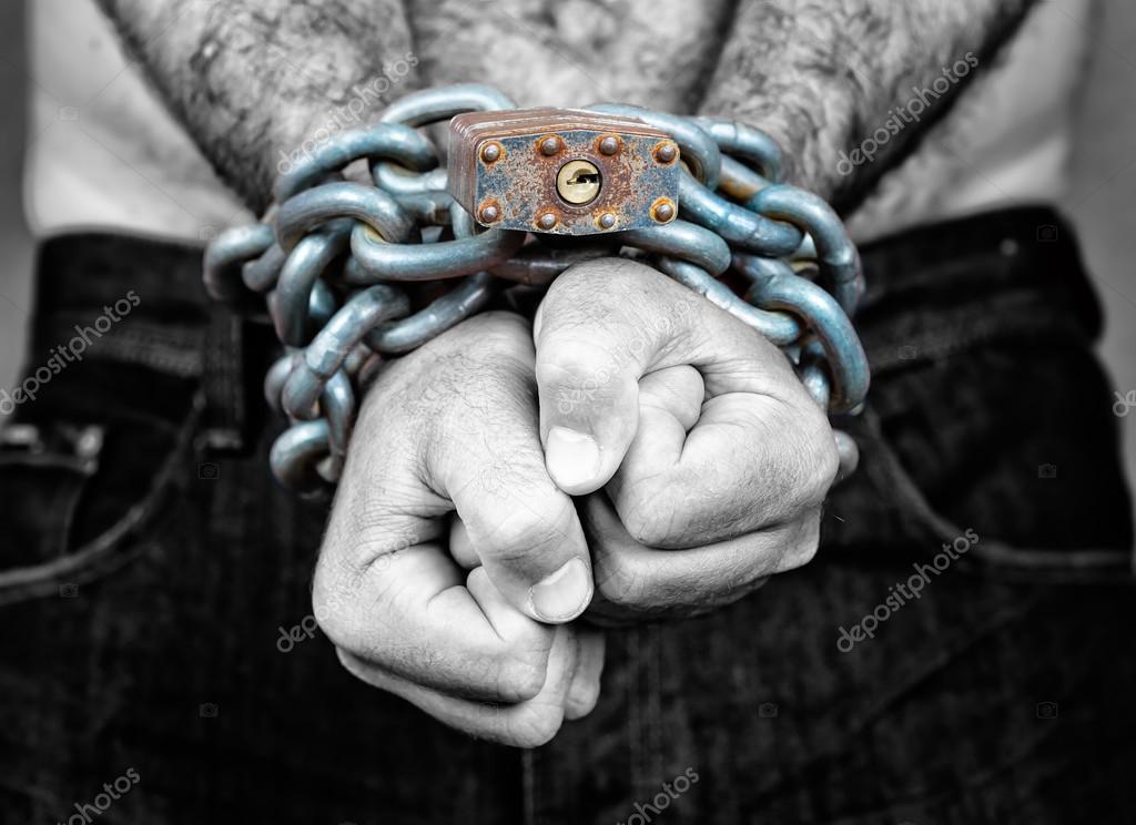 Man with his two hands chained Stock Photo by ©kmiragaya 26496973