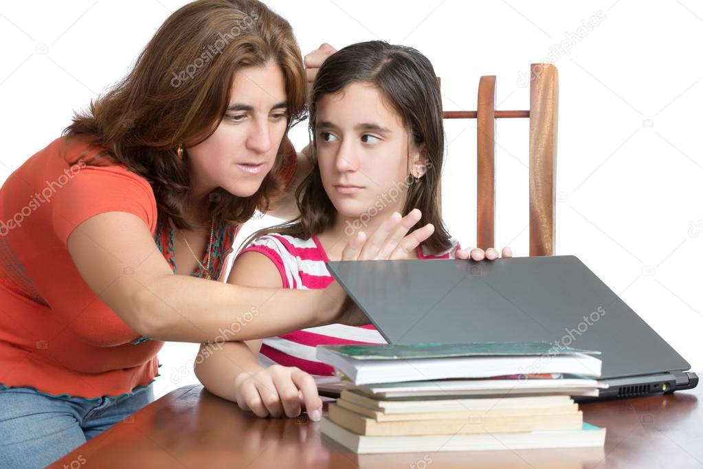 Mother checks her daughter internet activity — Stock Photo © kmiragaya ...