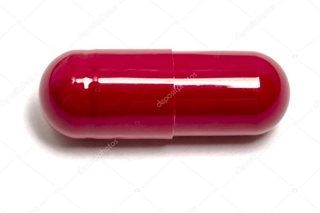 Cápsula roja: fotografía de stock © ibphoto #22490433 | Depositphotos