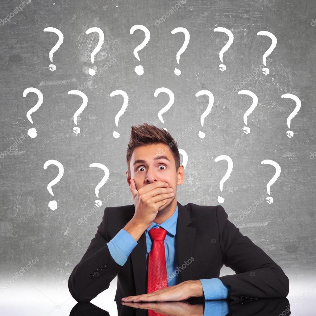 Business man looking shoked by all the questions — Stock Photo ...