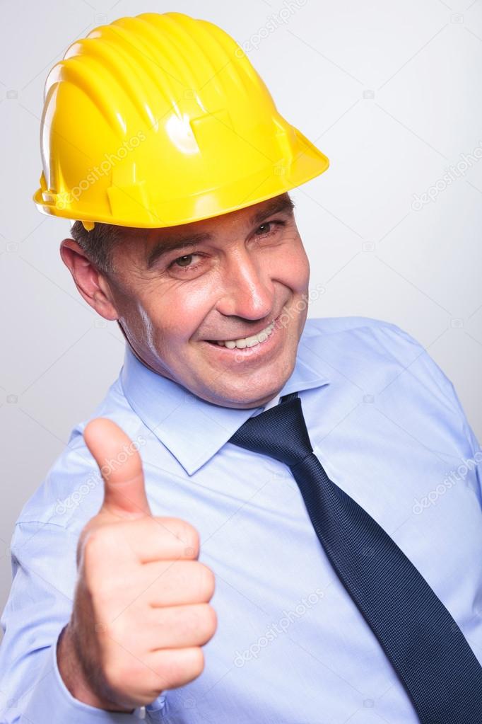 Old engineer shows thumb up Stock Photo by ©feedough 26353085