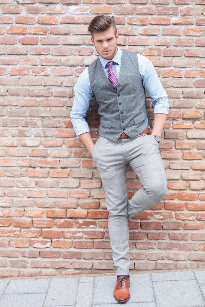 Casual man leans on wall and looks at camera — Stock Photo © feedough ...