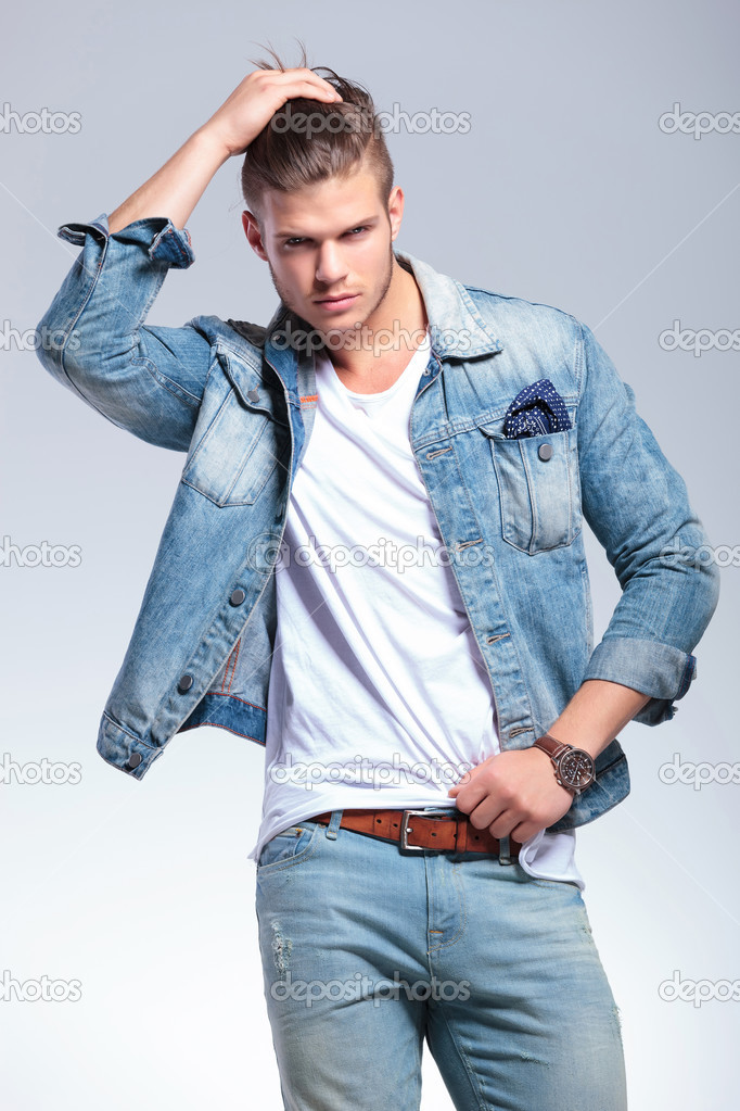 Cute young man passes his hand through hair ⬇ Stock Photo, Image by ...