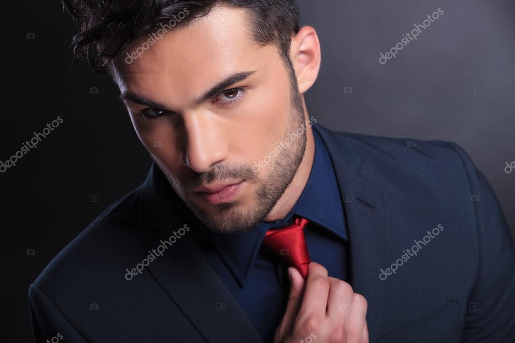 Business man fixes his tie Stock Photo by ©feedough 29639431