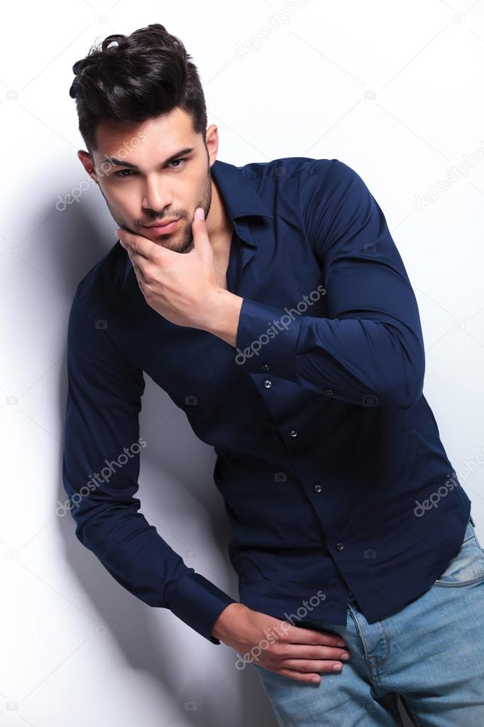 Young man in pensive pose Stock Photo by ©feedough 31400795
