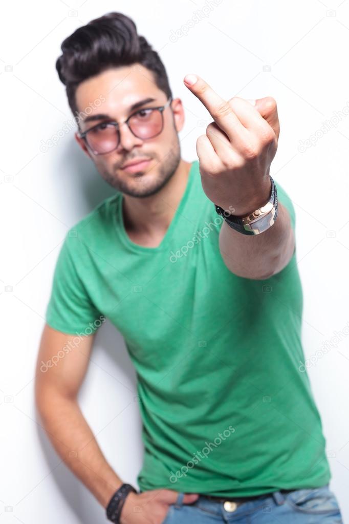 Casual man flipping you off — Stock Photo © feedough #31403327
