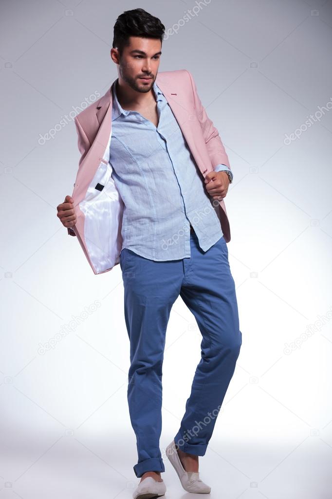 Casual man takes off his jacket and looks away Stock Photo by ©feedough ...