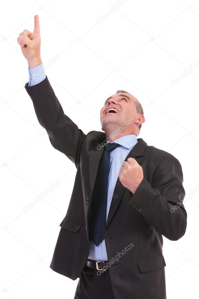 Business man cheers and points up — Stock Photo © feedough #33873305