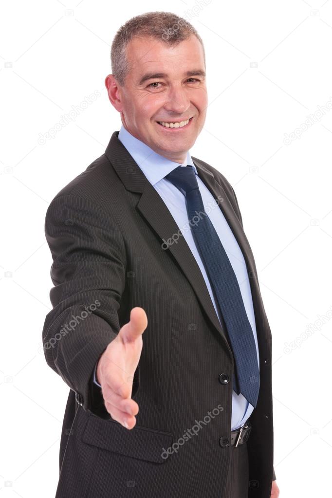 Business man offers handshake Stock Photo by ©feedough 33873665