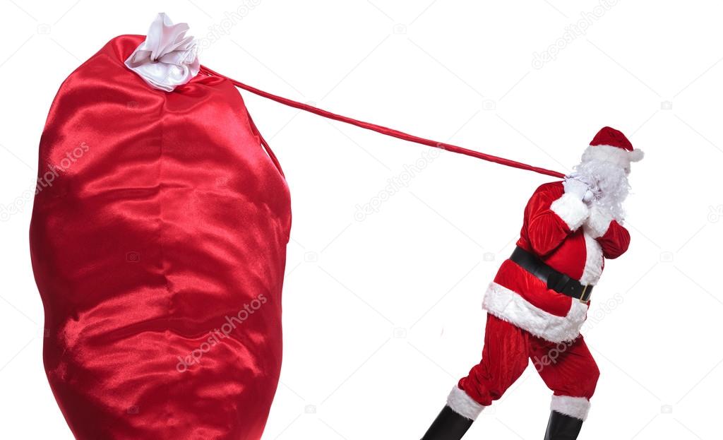 Santa claus is pulling a huge bag of presents Stock Photo by ©feedough ...