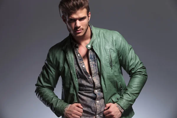 Fashion model in leather jacket with hands in his pockets Stock Photo ...