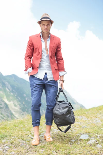 Young man walking with bag on the road — Stock Photo © feedough #41468951