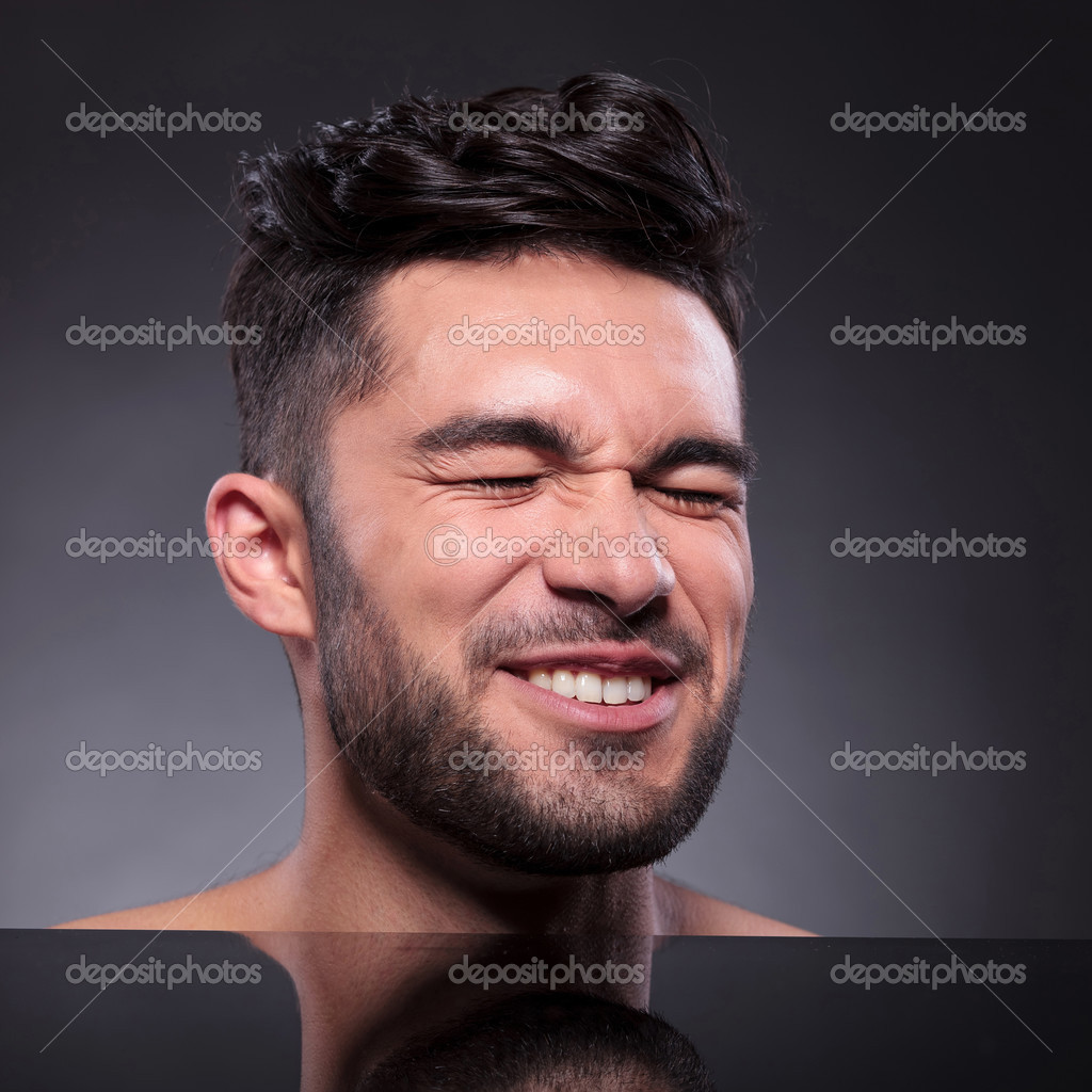 Head of a disgusted young man Stock Photo by ©feedough 42447649