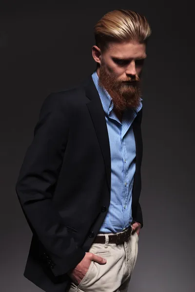 Bearded business man looks down Stock Photo by ©feedough 45805173