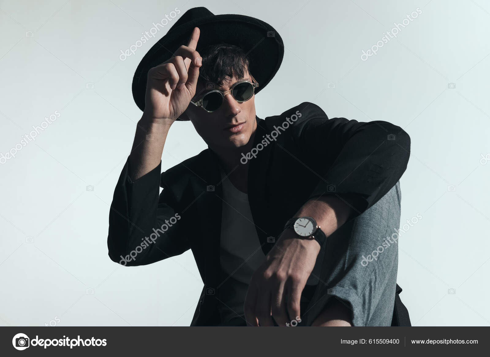 Stylish Man Adjusting Hat Holding Elbow Knee Posing Cool Way — Stock ...