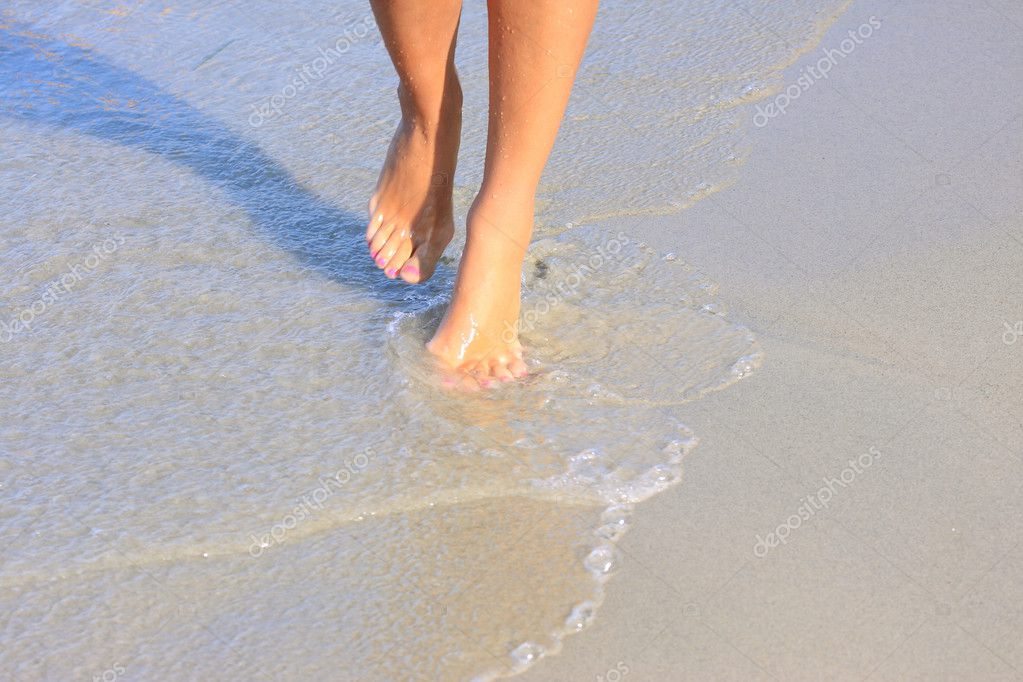 Legs on a beach Stock Photo by ©netfalls 18834721