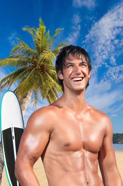 Man relaxing on the beach at exotic resort Stock Photo by ©netfalls ...