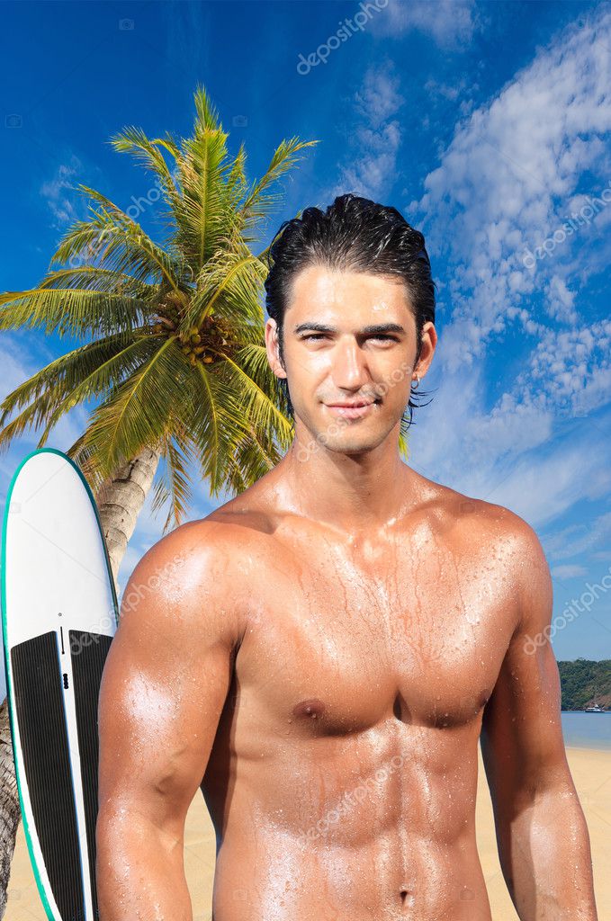 Man relaxing on the beach at exotic resort Stock Photo by ©netfalls ...