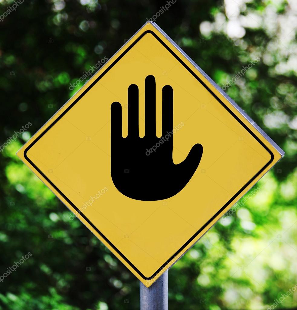 Yellow Stop Sign With Hand